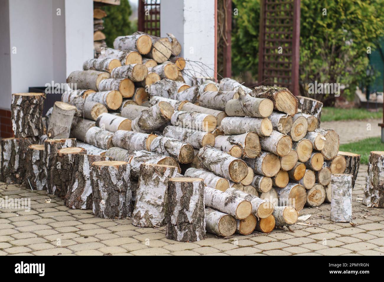 chopped wood stored by a suburban house Stock Photo - Alamy