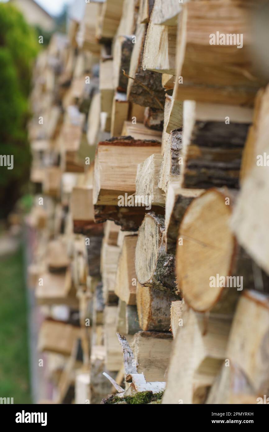 chopped wood stored by a suburban house Stock Photo - Alamy