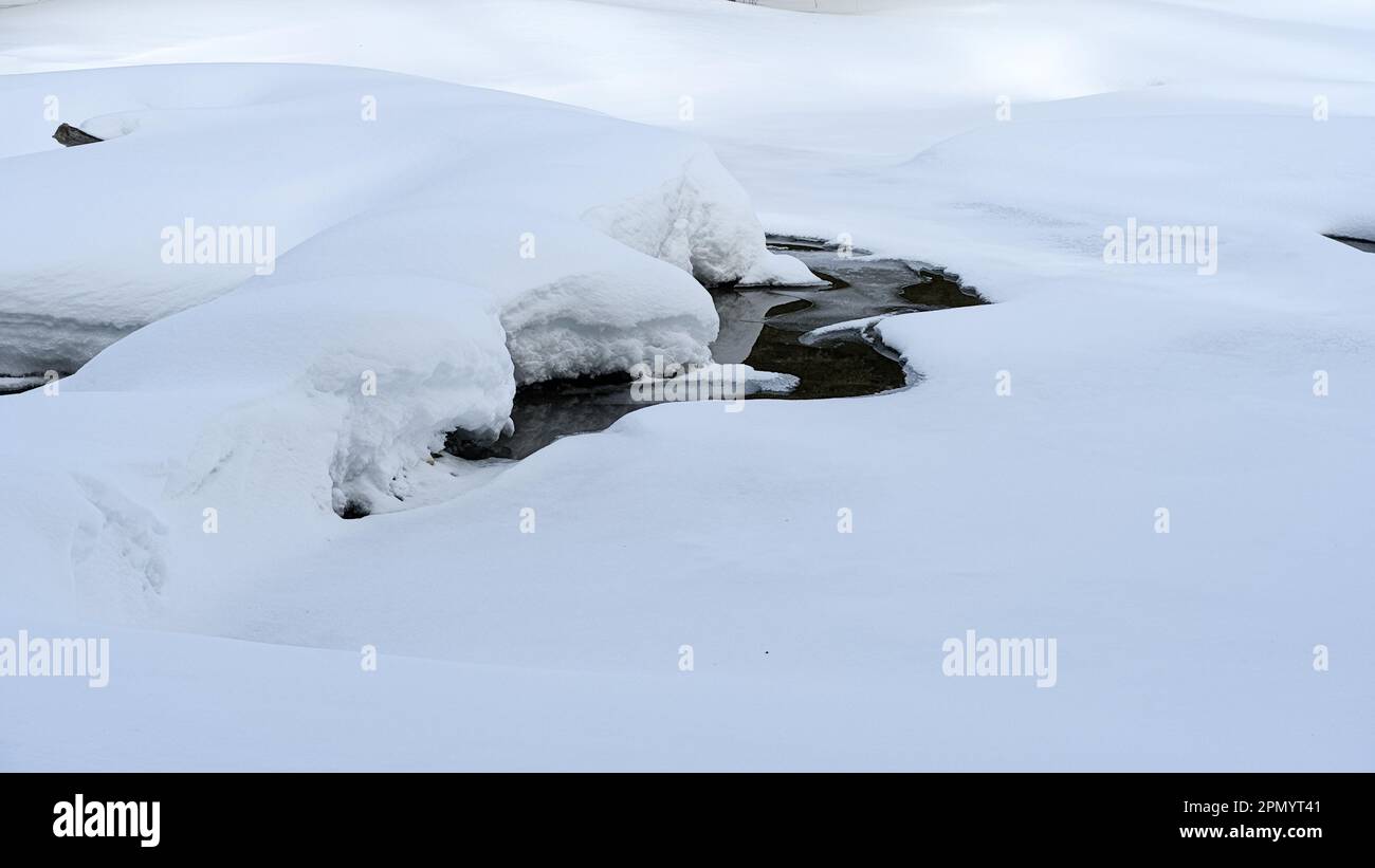 A frozen lake with snows. The middle has ice break up Stock Photo - Alamy