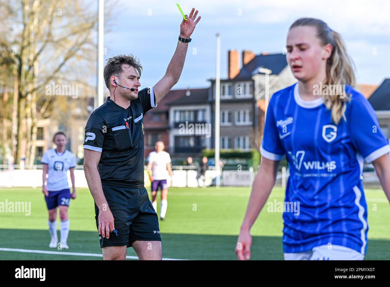 referee Yenthe Boogaerts gives yellow card during a female soccer game ...