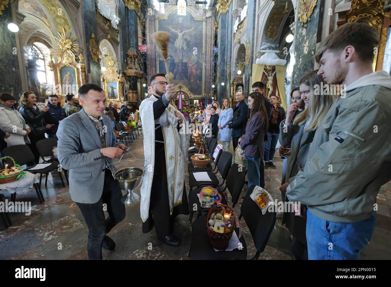 Lviv, Ukraine. 15th Apr, 2023. A Ukrainian priest blesses believers at ...