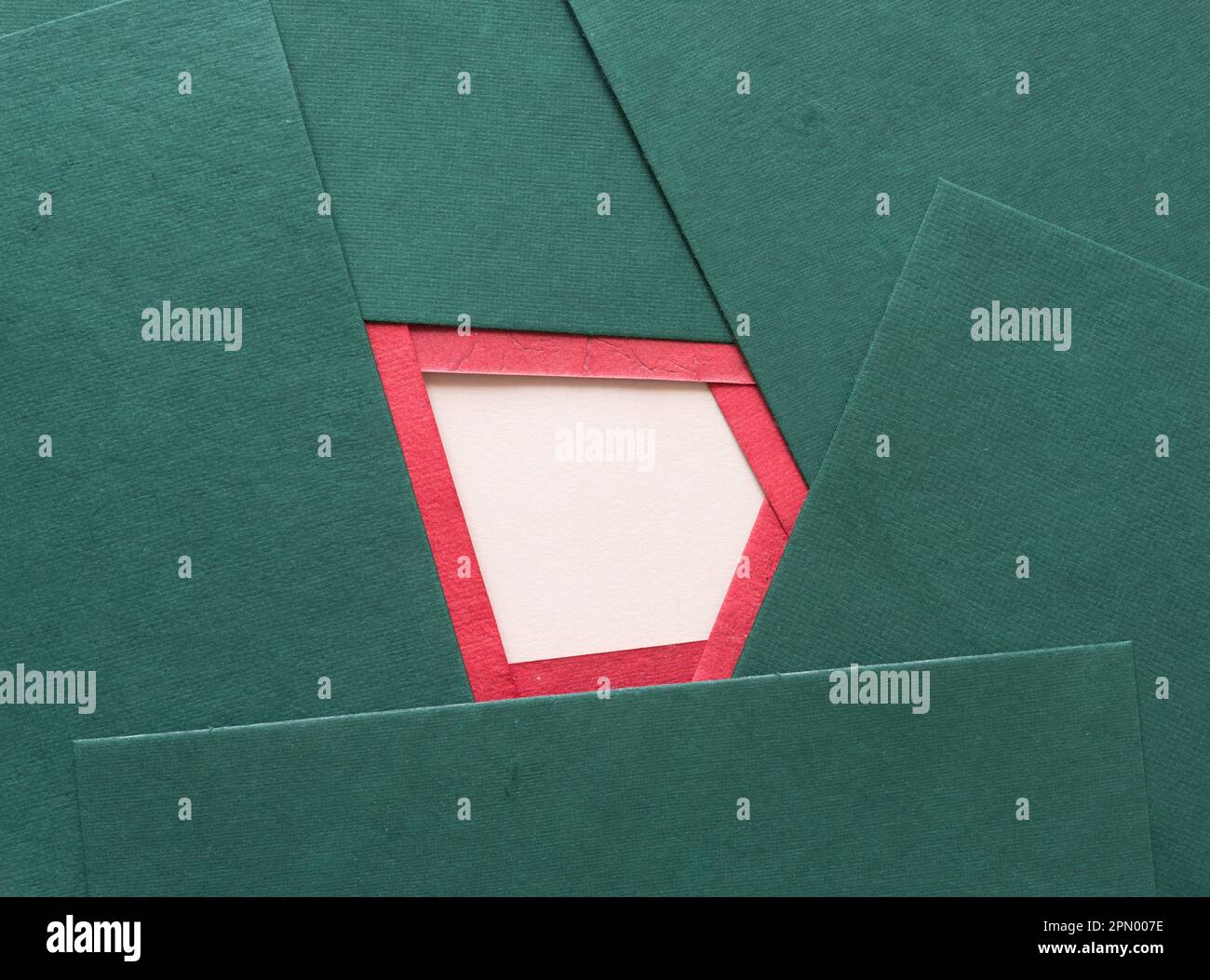 green paper background frame with red liner and irregularly shaped ...