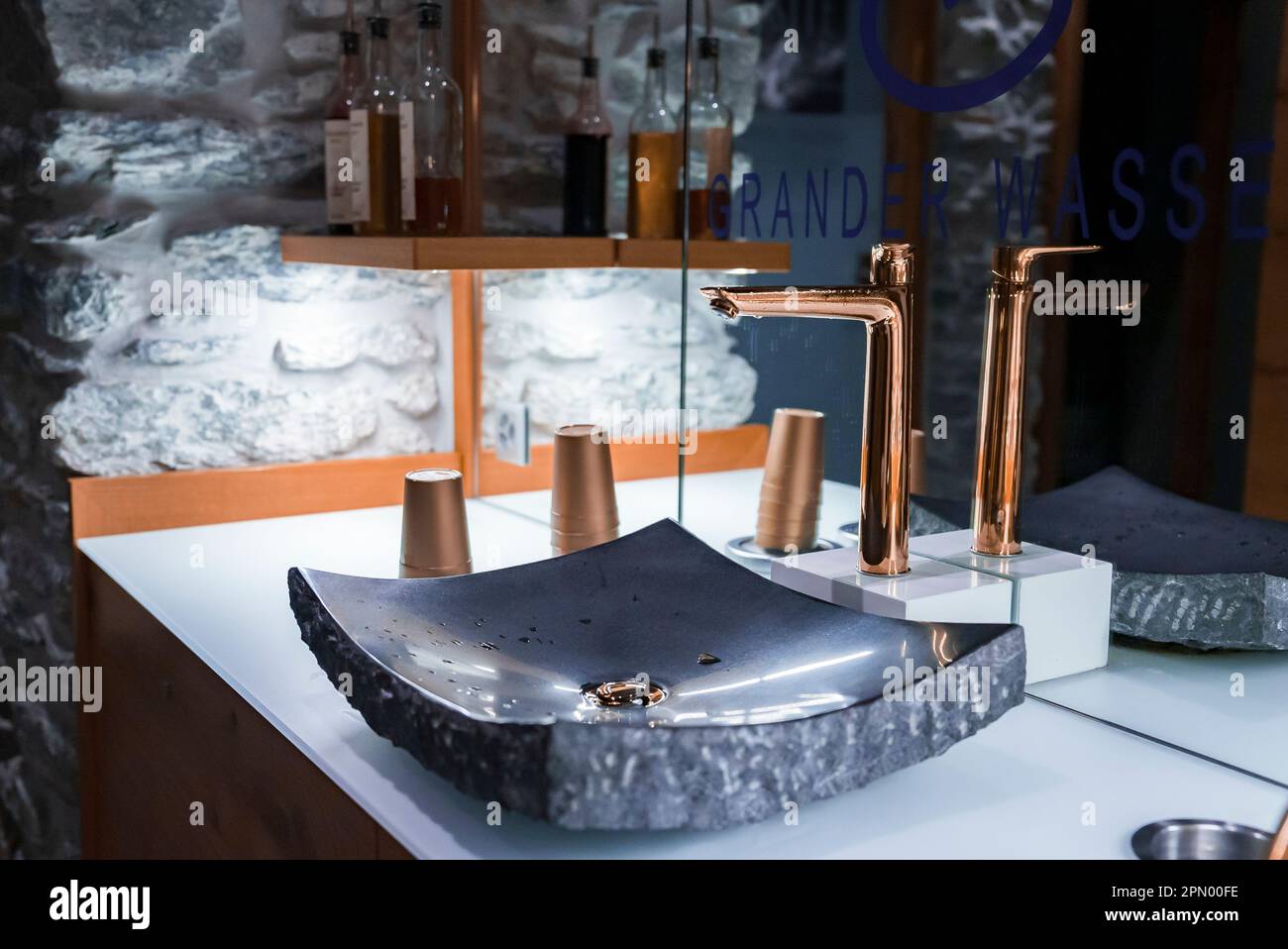 Sink and faucet reflecting on mirror in bathroom at luxury hotel Stock ...