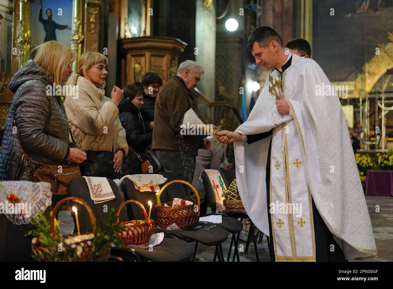Lviv, Ukraine. 15th Apr, 2023. A Ukrainian priest blesses believers at ...