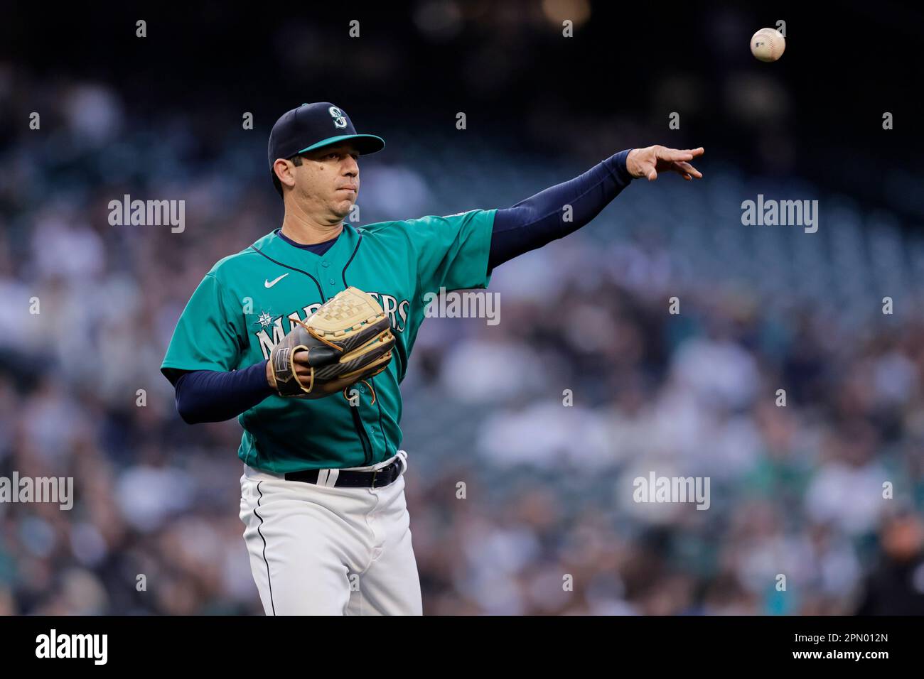 Seattle Mariners starting pitcher Tommy Milone throws the ball to first ...