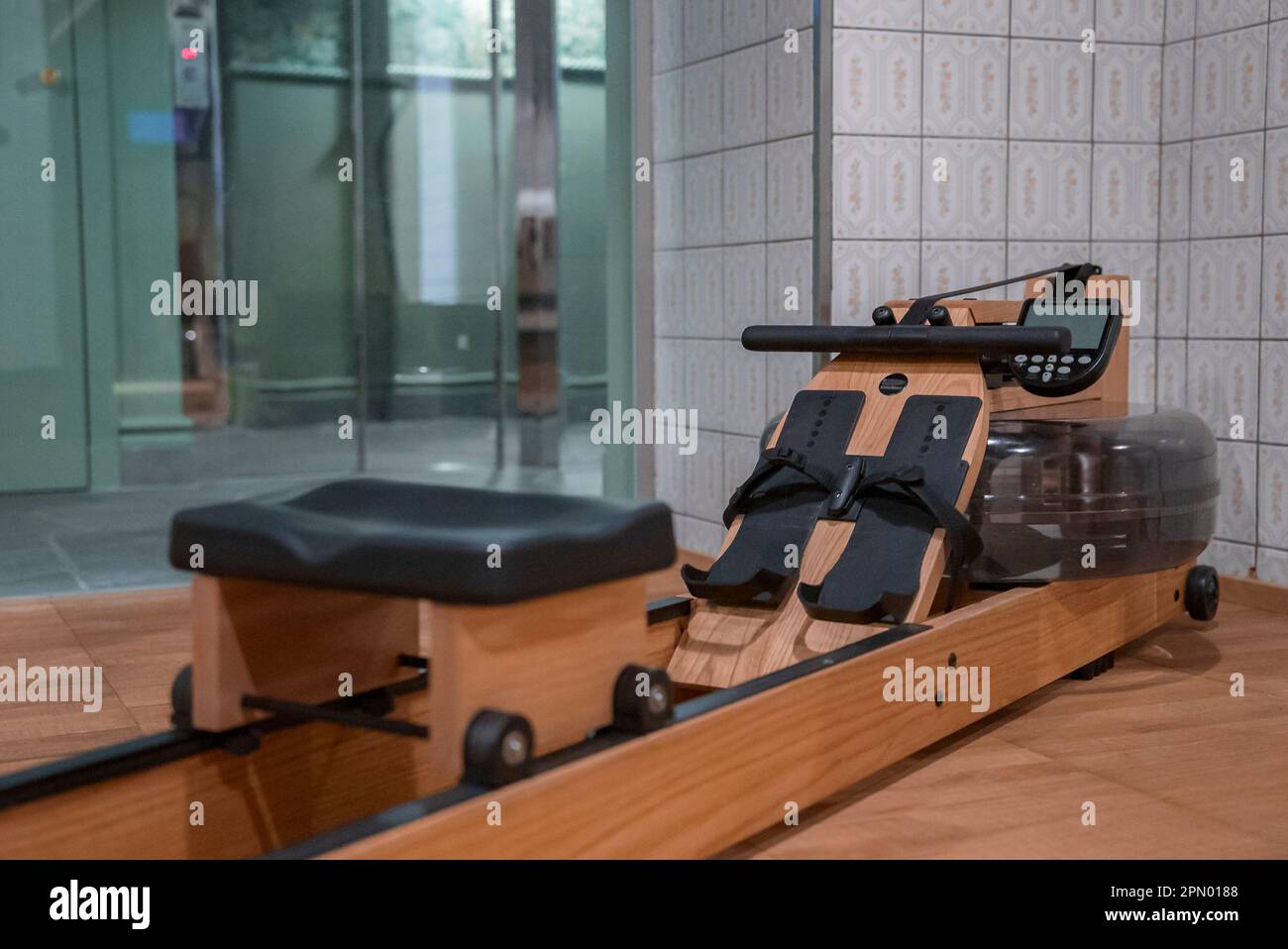 Rowing machine on hardwood floor in exercise room at luxury hotel Stock ...