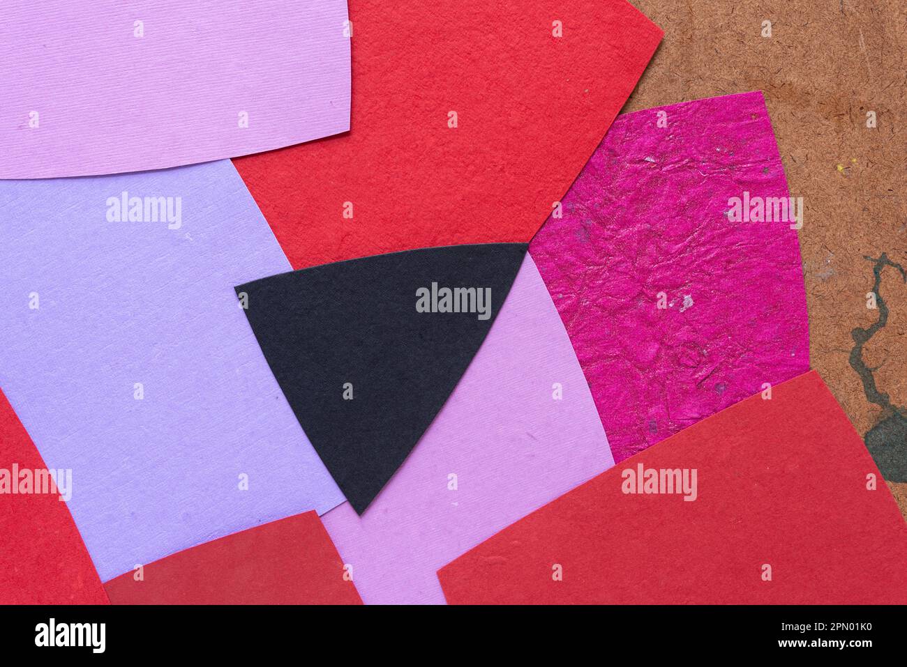 paper sheets some cut with rounded edges on old art board with odd ...