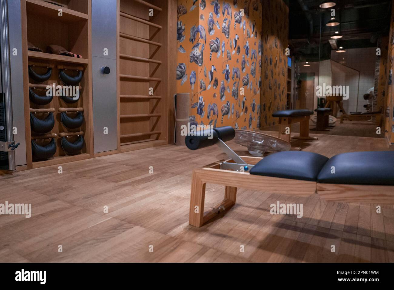 Wooden abdominal bench placed in exercise room at hotel Stock Photo - Alamy