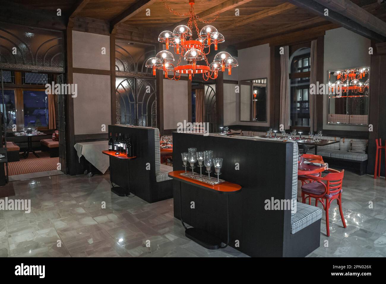 Chandelier hanging over furniture in luxury alpine restaurant Stock ...