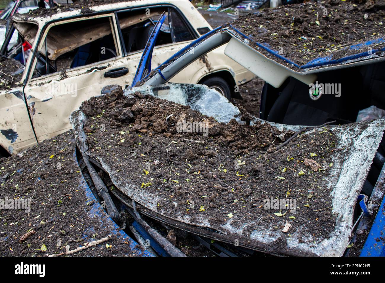 Destroyed car near the explosion. Aftermath of a missile attack on the ...