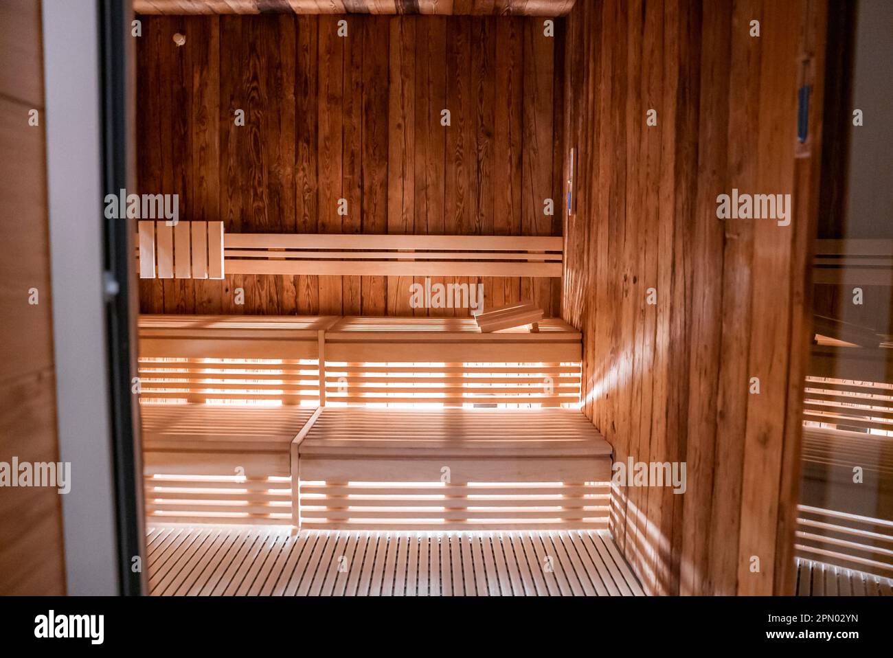 Interior of sauna with wooden wall and bench in modern hotel Stock ...