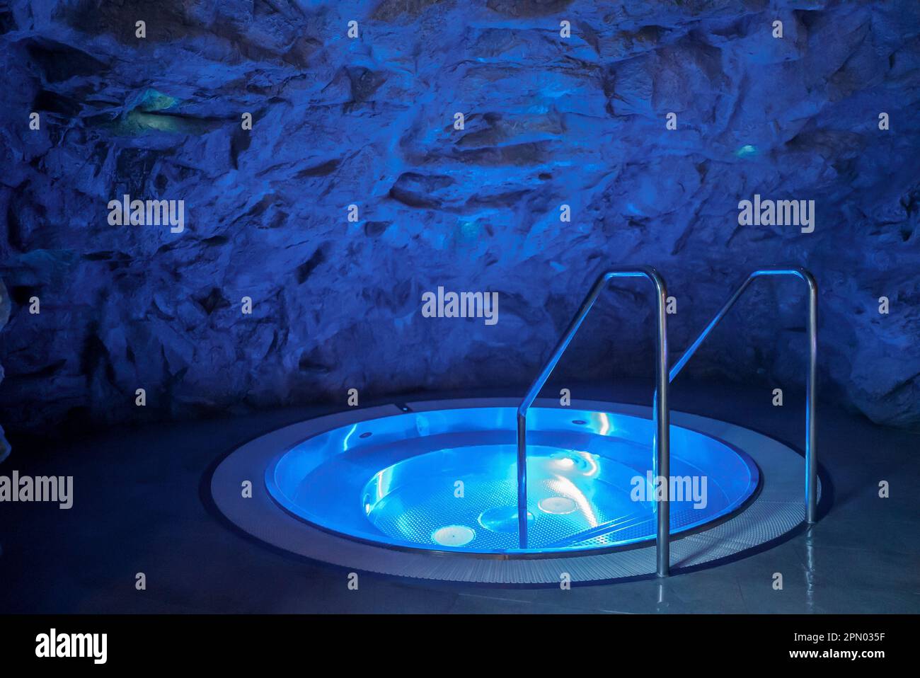 Luxury hotel with small swimming pool in front of wall Stock Photo - Alamy