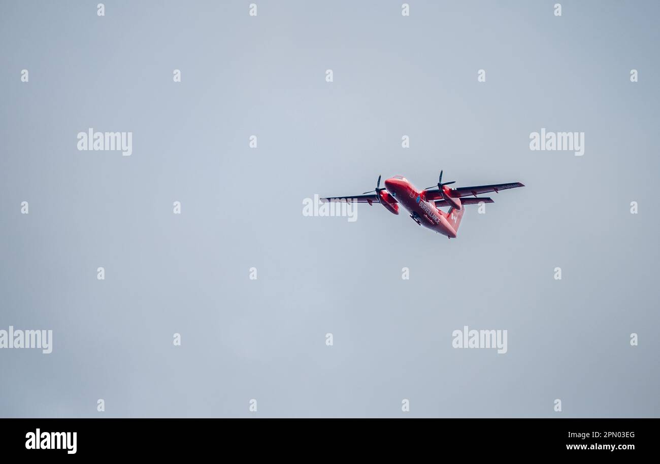 A red Transport Canada aerial Dash-8 turboprop NASP surveillance plane ...
