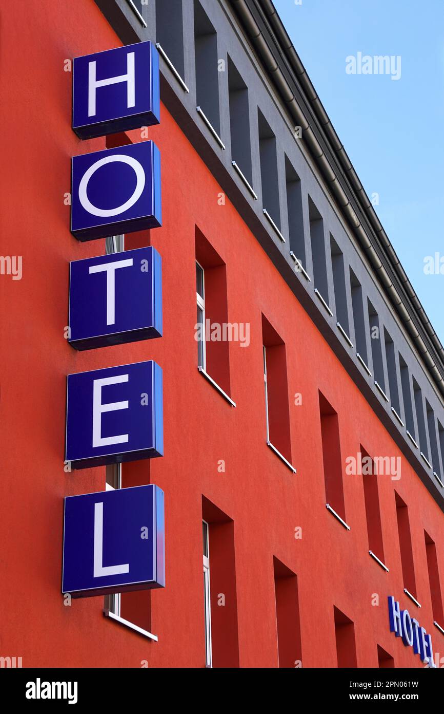 colorful modern facade with hotel sign Stock Photo - Alamy