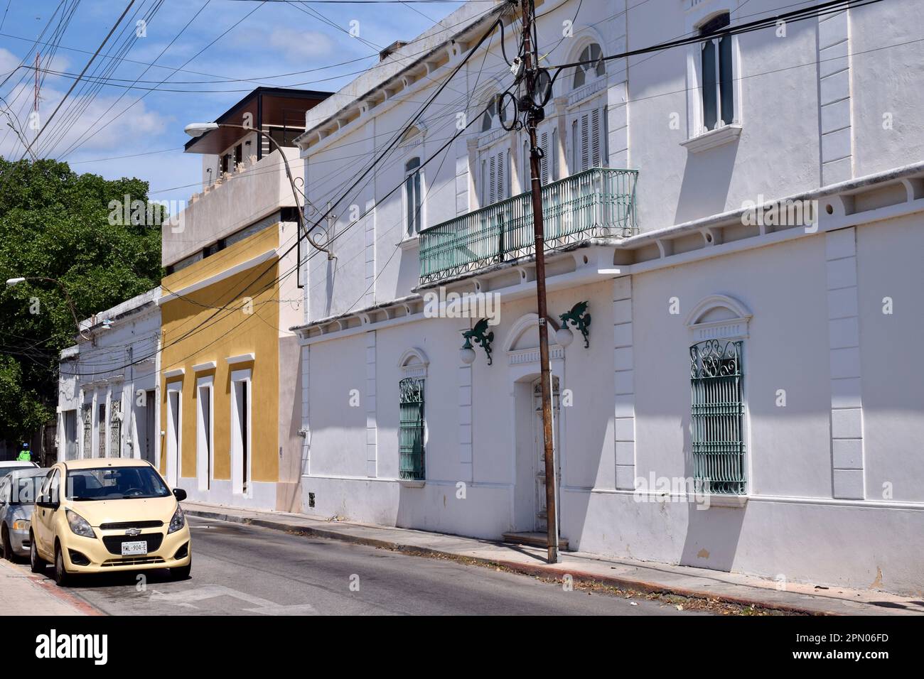 The colorful facades of restored buildings in the historic city of ...