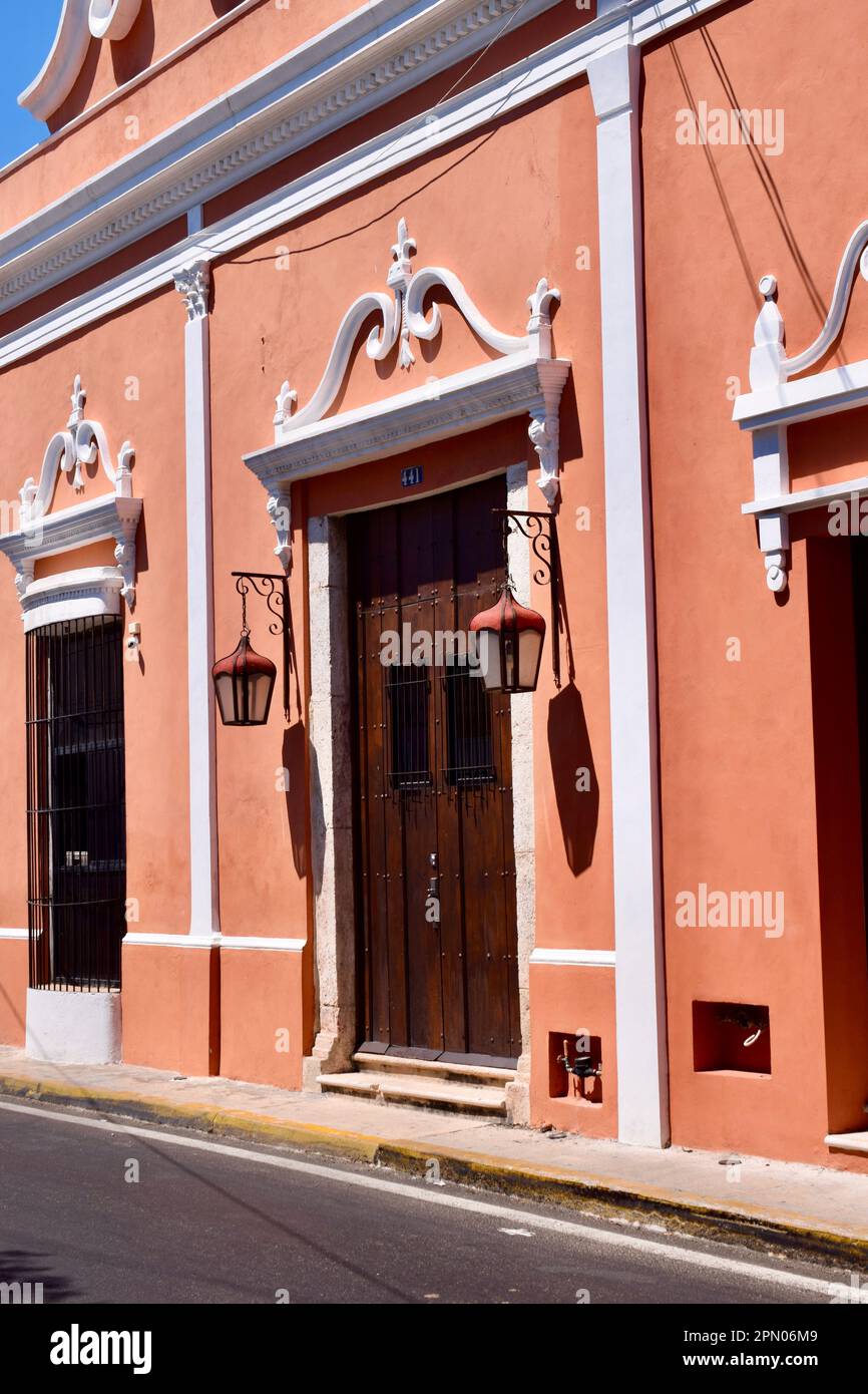 A beautifully restored, orange building in the historic city of Merida ...