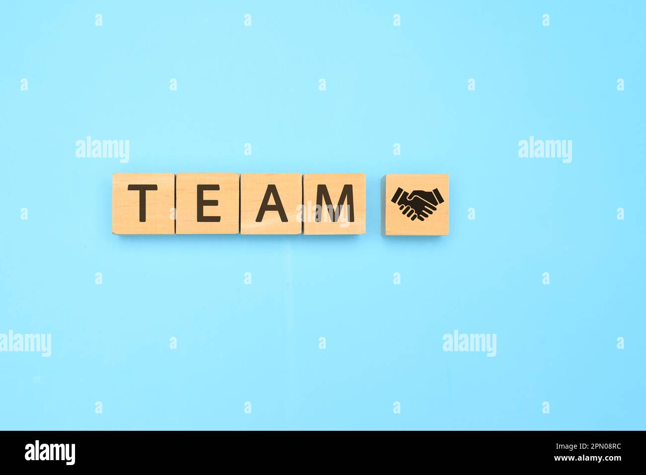 Teamwork text on wooden cube with abstract blue background Stock Photo ...