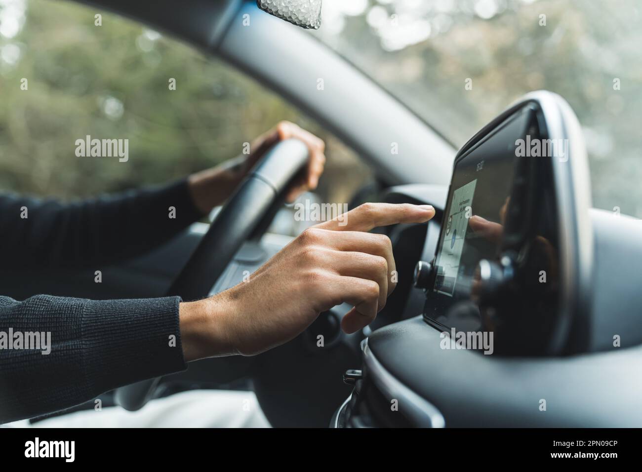 Closeup finger of a man car driver touching navigation screen . High ...