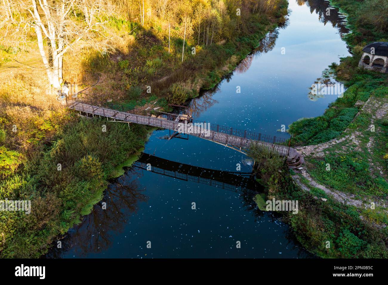 Top view of the footbridge over a small river Stock Photo - Alamy