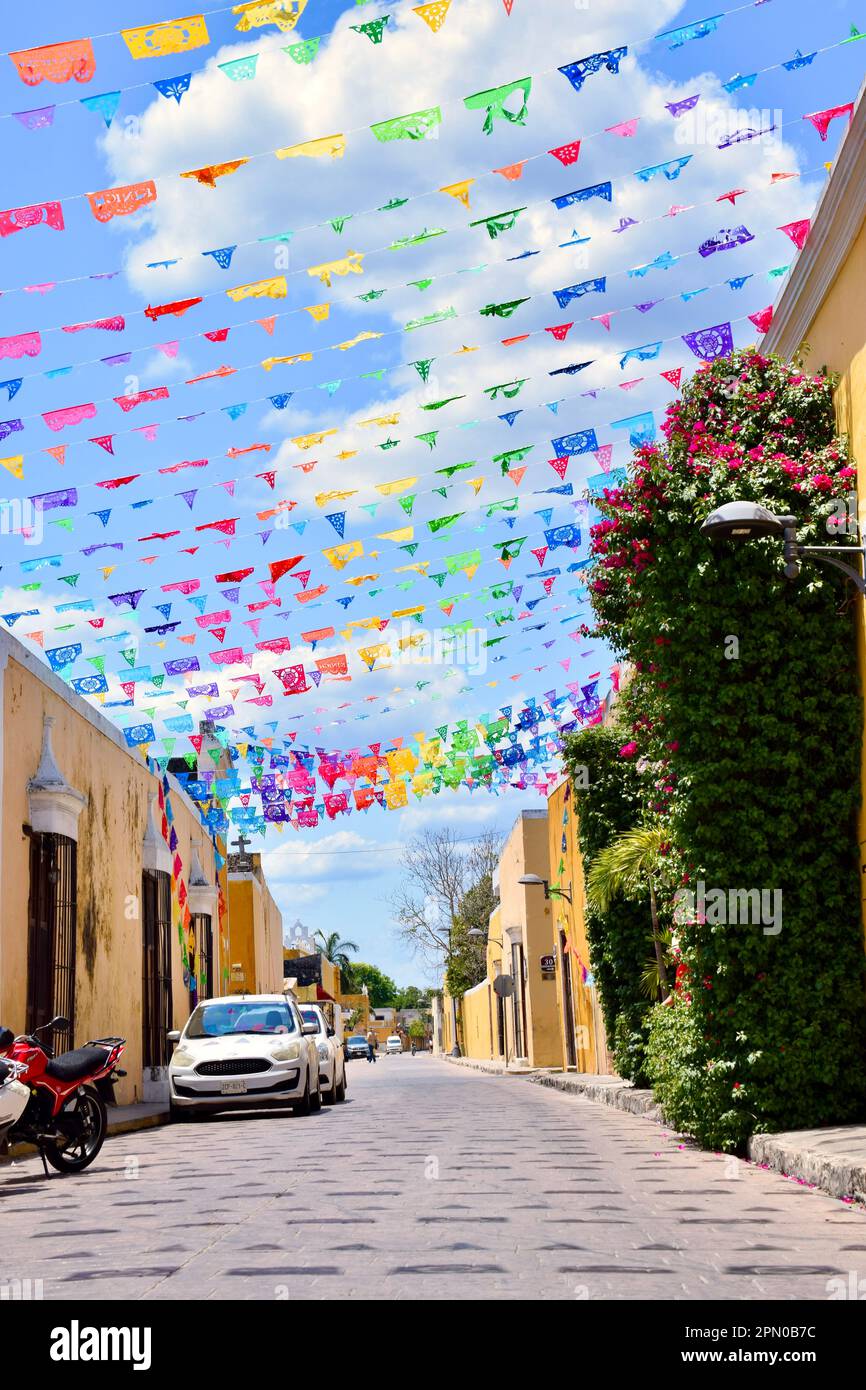 A cute and colorful side street in the "pueblo magico"of Izamal ...