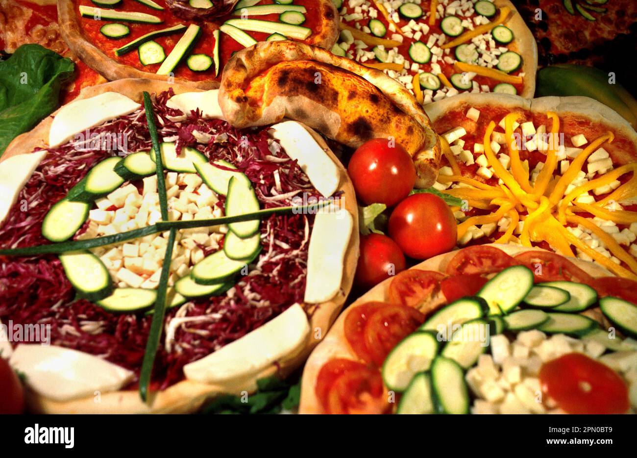 Italian food, different kinds of Pizza with vegetables Stock Photo - Alamy