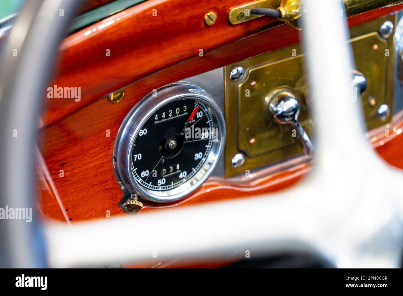 Oldtimer car wood-covered dashboard with odometer Stock Photo - Alamy