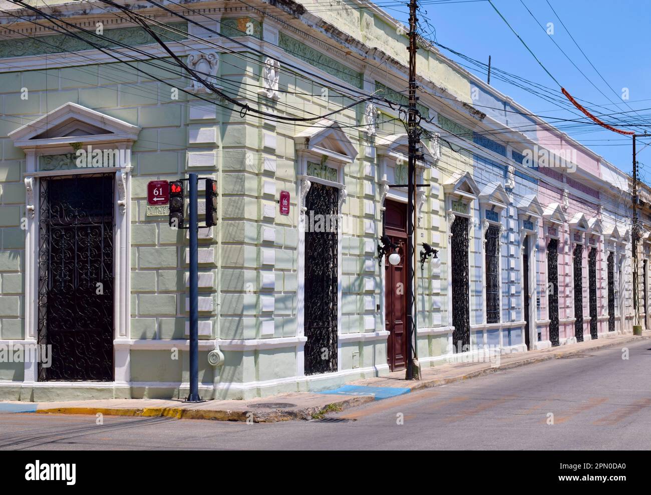 A row of pastel-colored buildings in a street of the historic center of ...