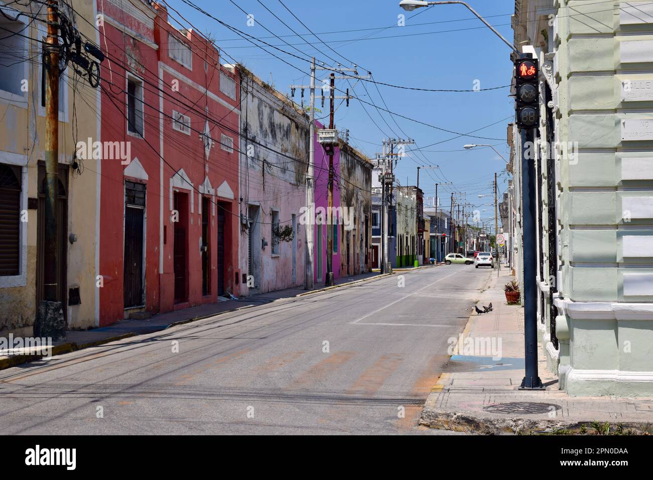 A street in Merida, Yucatan, Mexico, with colorful building facades ...