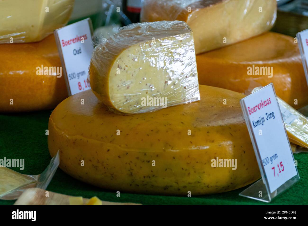 Tasting of different cheeses in Dutch cheese farm shop, English ...