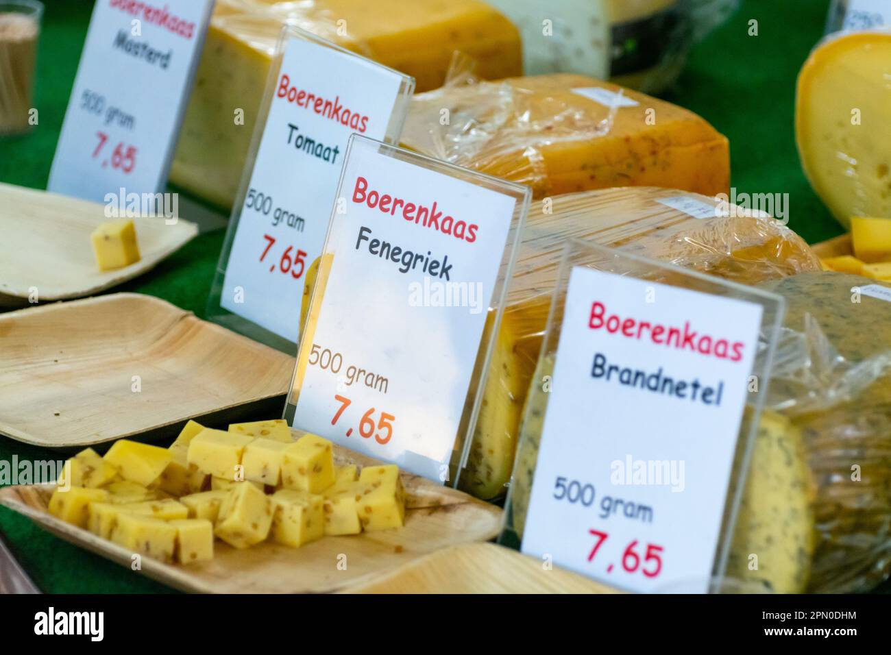 Tasting of different cheeses in Dutch cheese farm shop, English ...