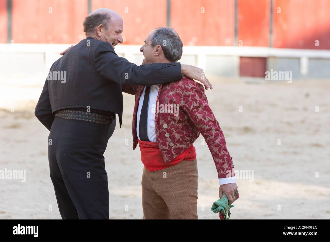 March 26, 2023 Lisbon, Portugal: Tourada - two smiling elderly men hug ...