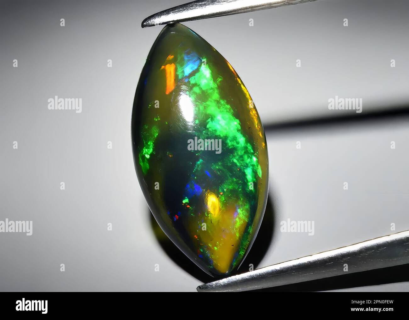 Natural precious stone noble opal on a black background Stock Photo - Alamy