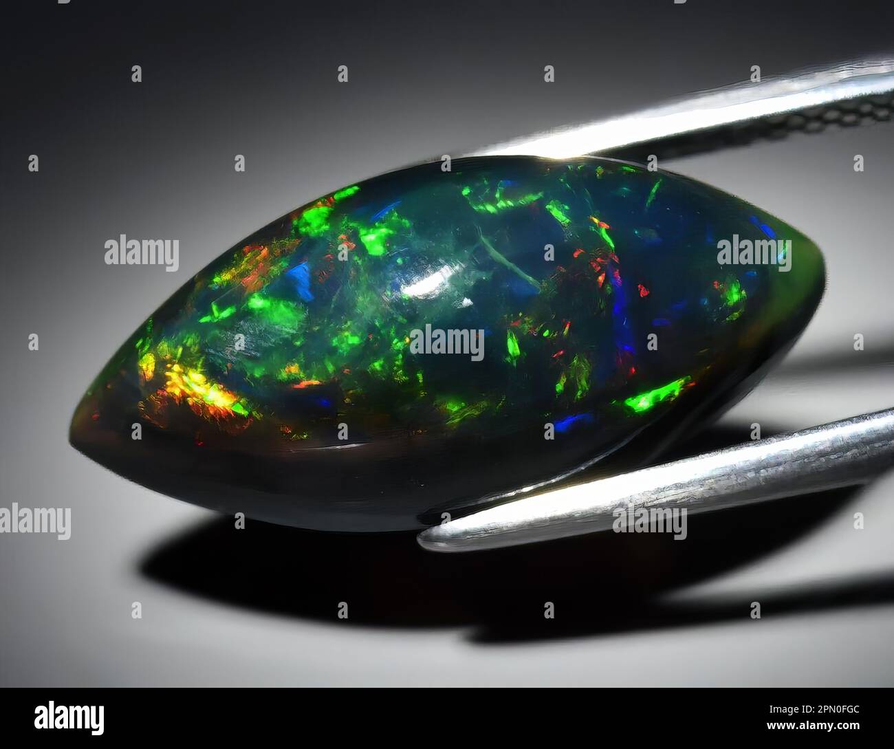 Natural precious stone noble opal on a black background Stock Photo - Alamy