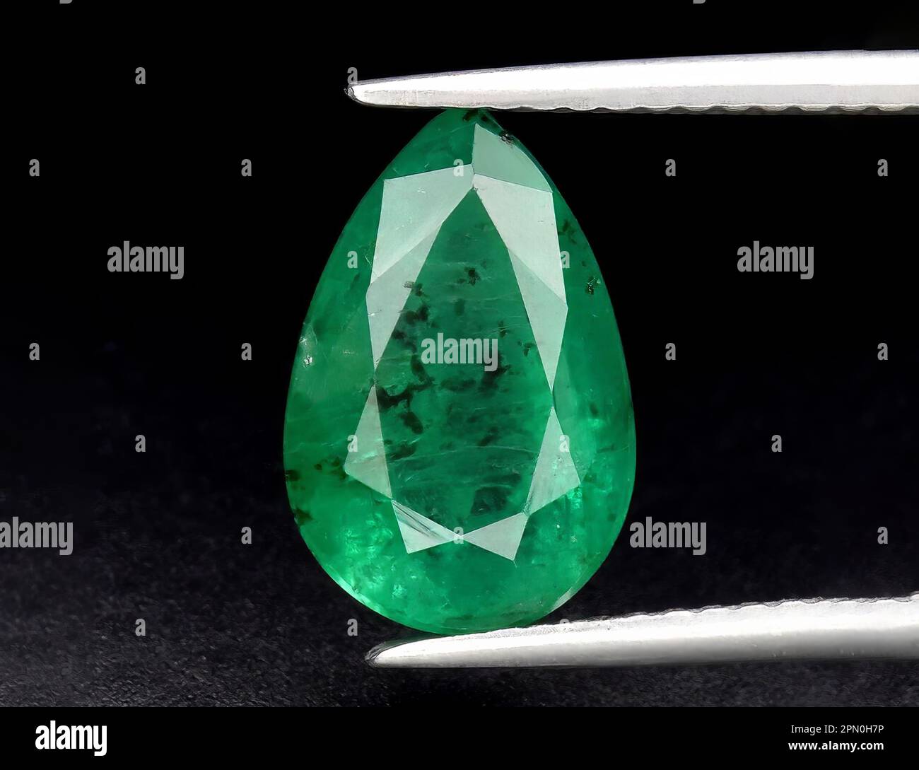 Natural gem green emerald on black background Stock Photo - Alamy