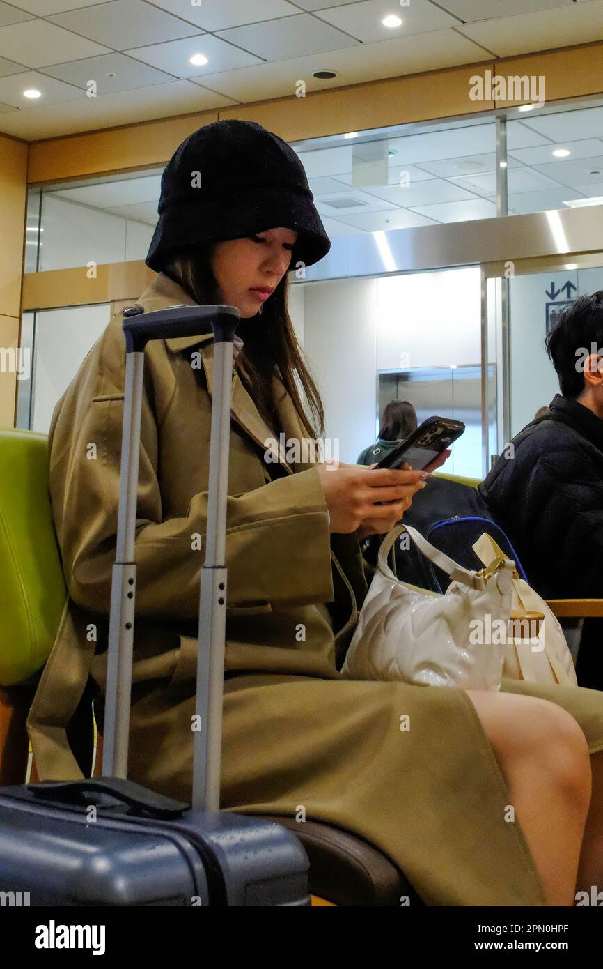 April 15, 2023, Tokyo, Japan: A woman is seen waiting for high-speed ...