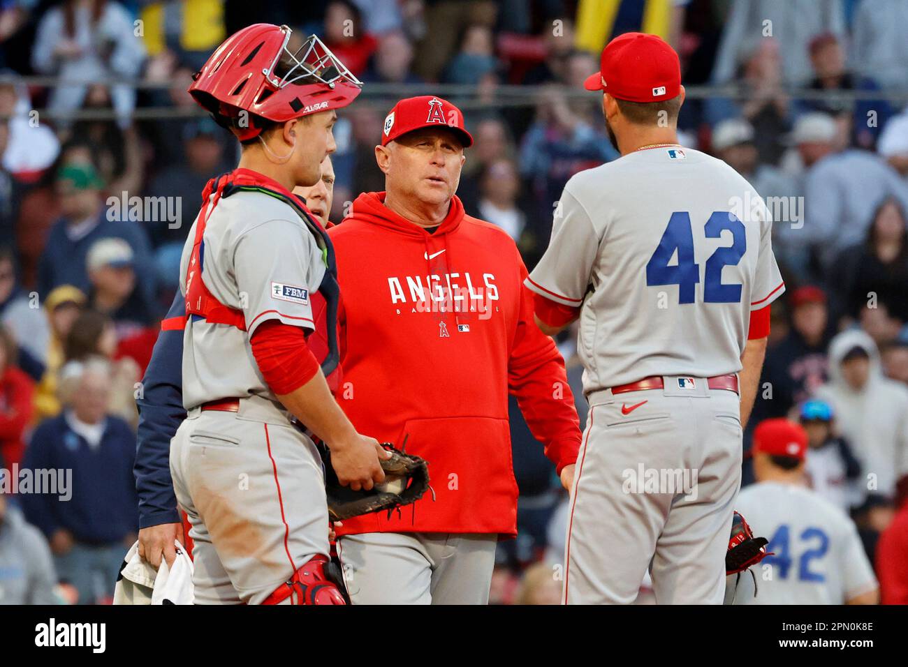 Los Angeles Angels manager Phil Nevin, center, talks with pitcher Ryan ...