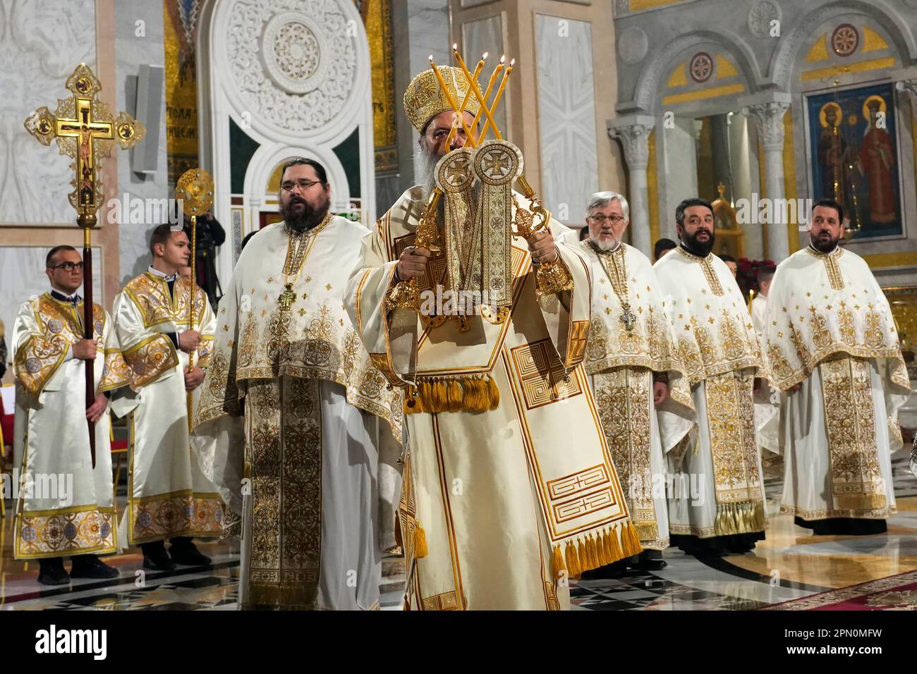 Patriarch Porfirije, center, leads the traditional Orthodox Easter ...
