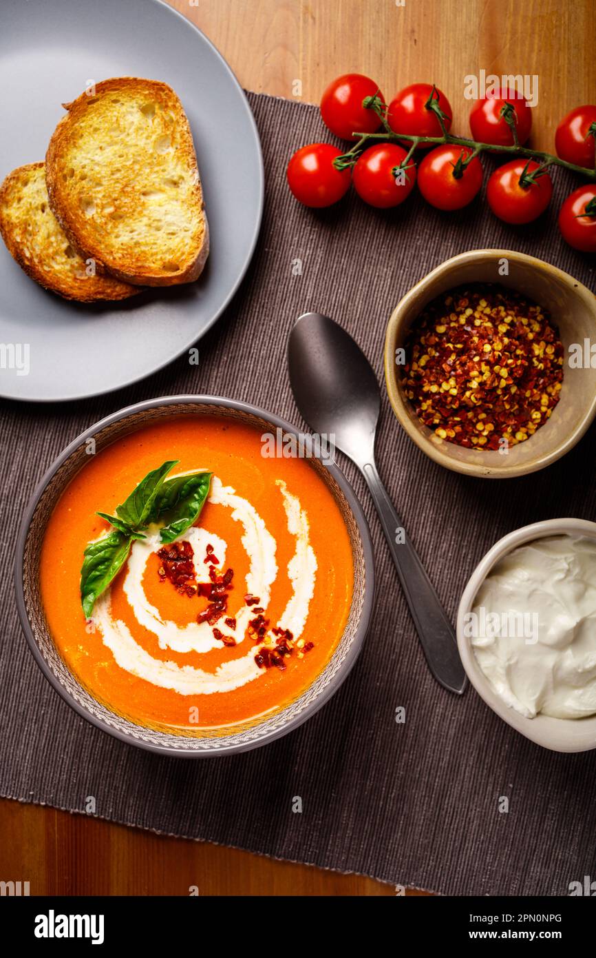 creamy tomato soup with toast Stock Photo - Alamy