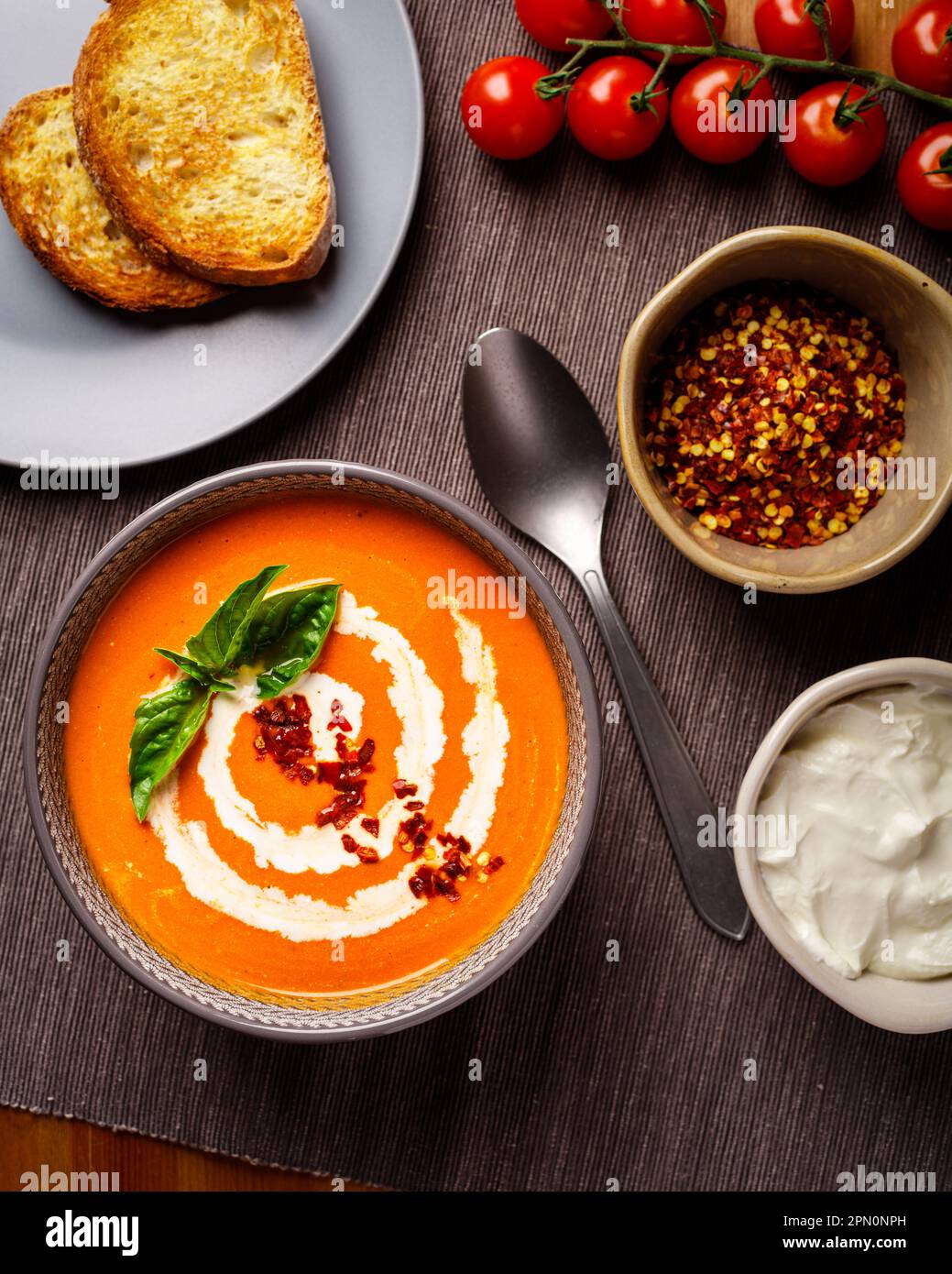 creamy tomato soup with toast Stock Photo - Alamy
