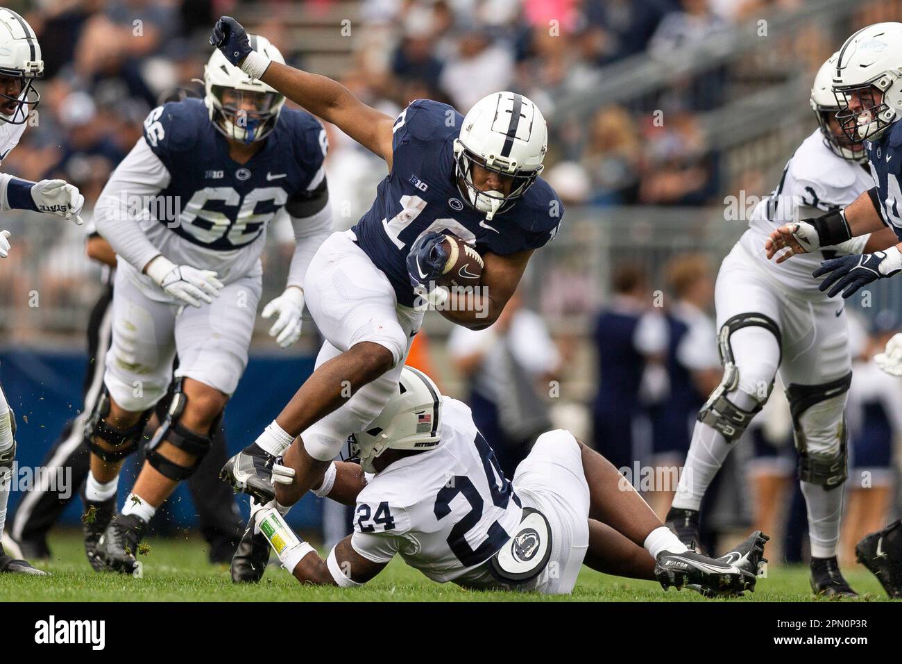 Penn State running back Nick Singleton is tackled by linebacker Ta'Mere Robinson during the ...