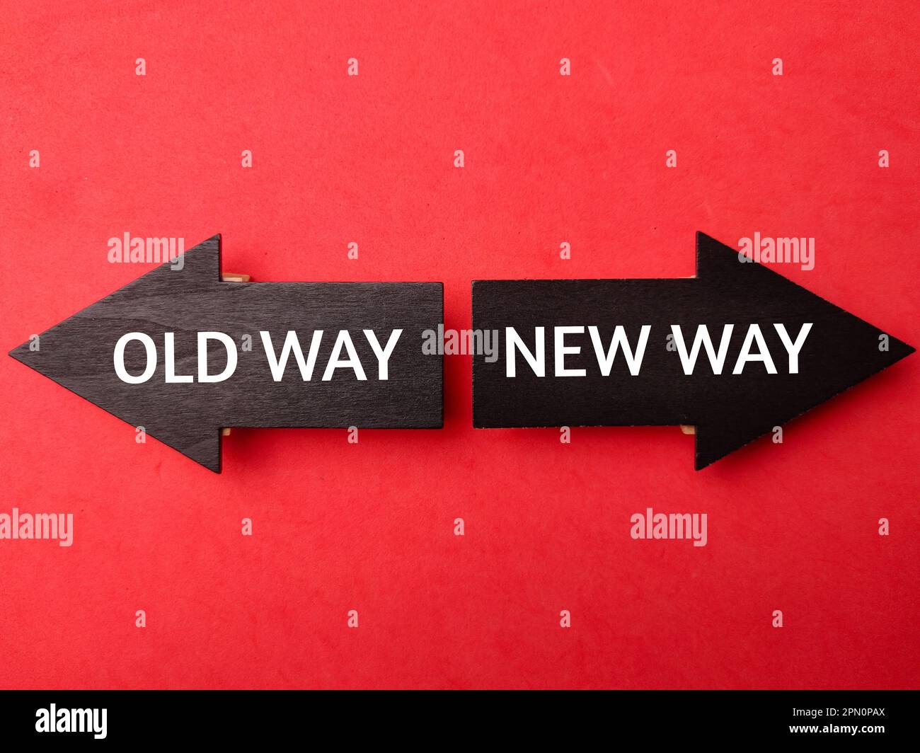 Wooden arrow with the word OLD WAY NEW WAY on a red background Stock ...