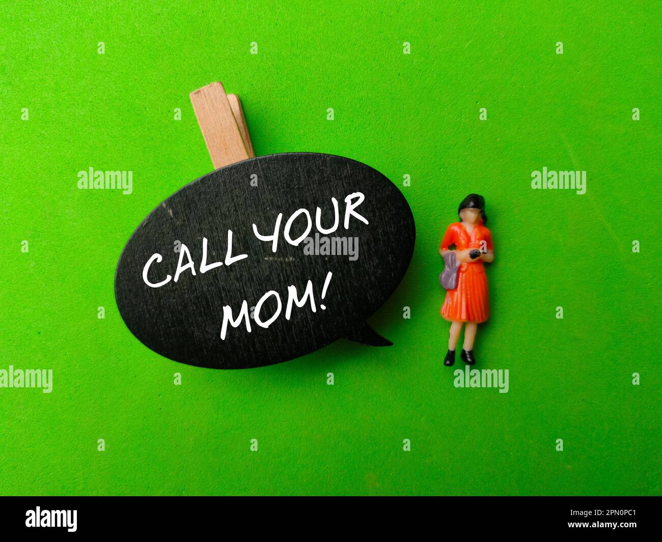 Wooden sign board with the word CALL YOUR MOM on green background Stock ...
