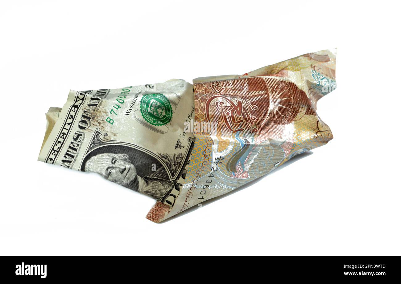 Money inflation and losing value, drop concept, Crumpled Kuwaiti money ...