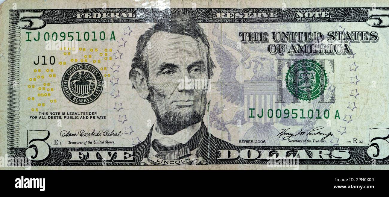Large fragment of the obverse side of a torn 5 five dollars bill ...