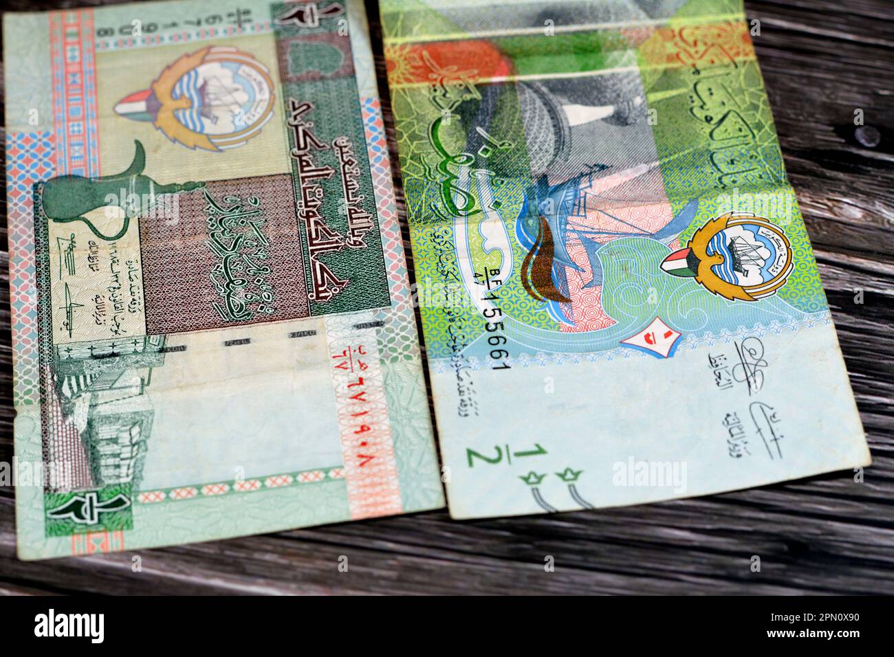 Old and new Kuwaiti half dinar bill banknotes money coat of arms of ...