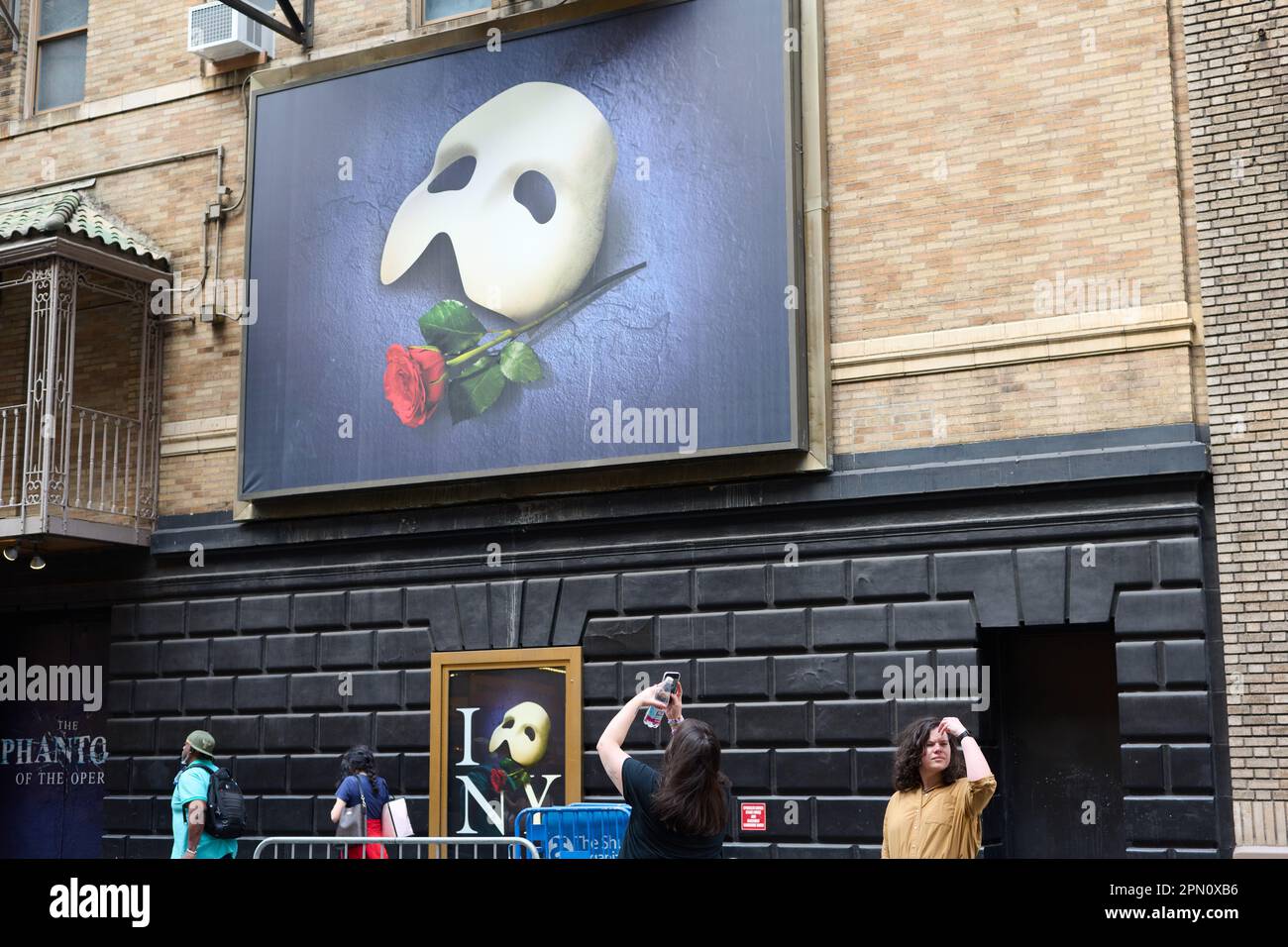 New York, New York, USA. 14th Apr, 2023. A woman takes a photograph of the Phantom of The Opera ...