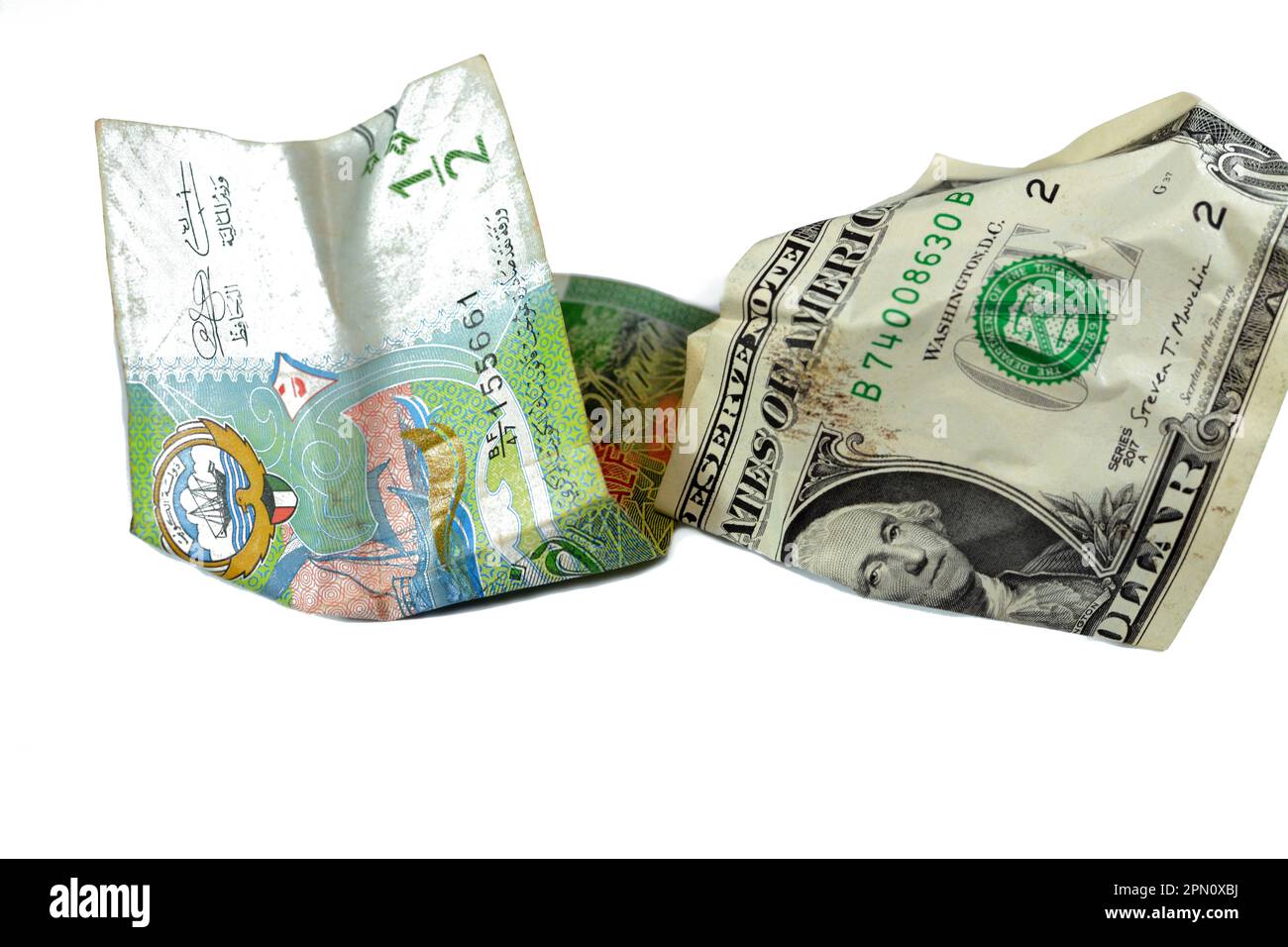 Wrinkled and crumpled Kuwaiti half KWD dinar bill banknote and 1 one ...