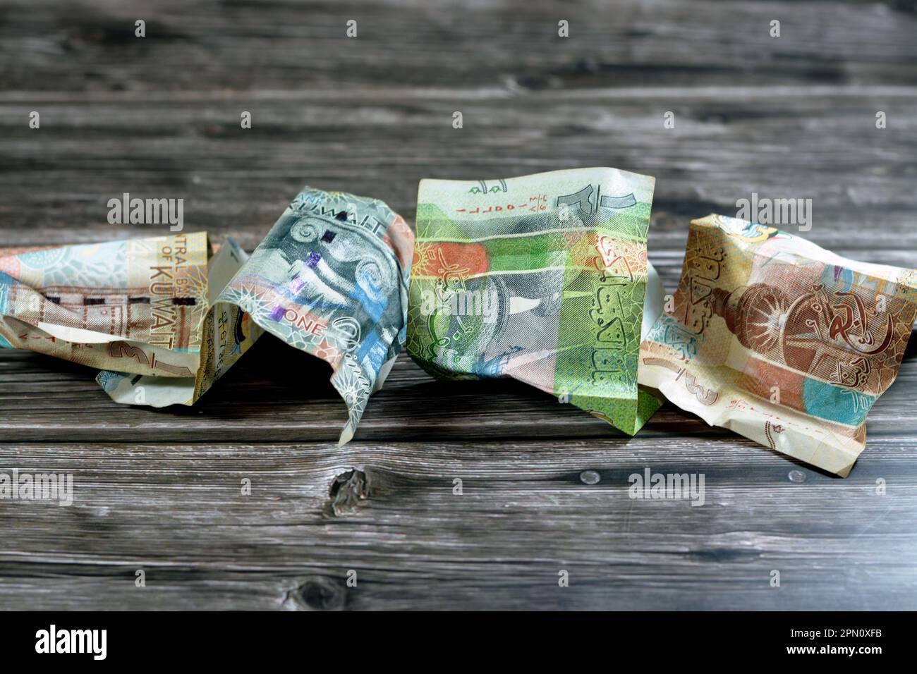crumpled Kuwaiti money of quarter, half and one KWD Kuwait dinar bills ...