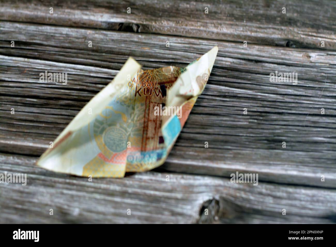 Crumpled Kuwaiti money of change KWD quarter Kuwait dinar bill banknote ...
