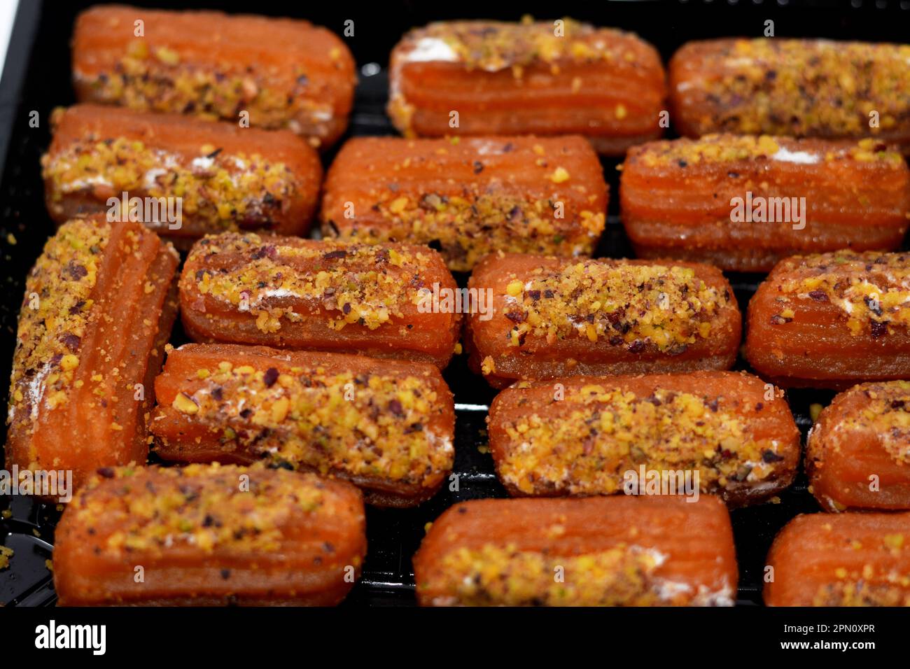 Tulumba, Bamiyeh or Balah El Sham stuffued with whipped cream and ...